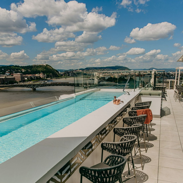 An Aston Martin above Budapest: luxury car lifted onto the roof of the ...